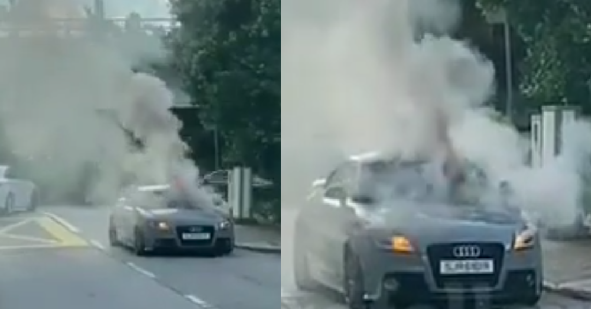 AUDI SPORTS CAR SEEN ENGULFED IN FLAMES ON THE ROAD