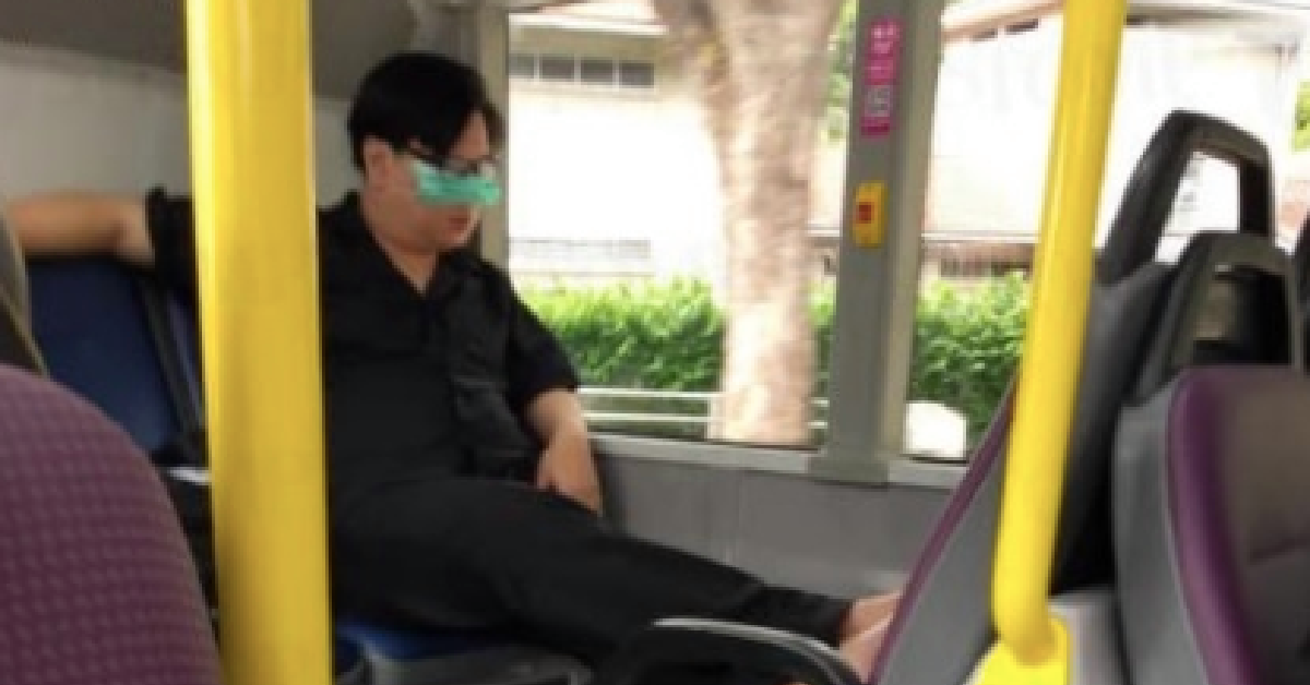 INCONSIDERATE MAN REMOVES SHOES & PUTS FEET ON SEAT. DID NOT WEAR MASK