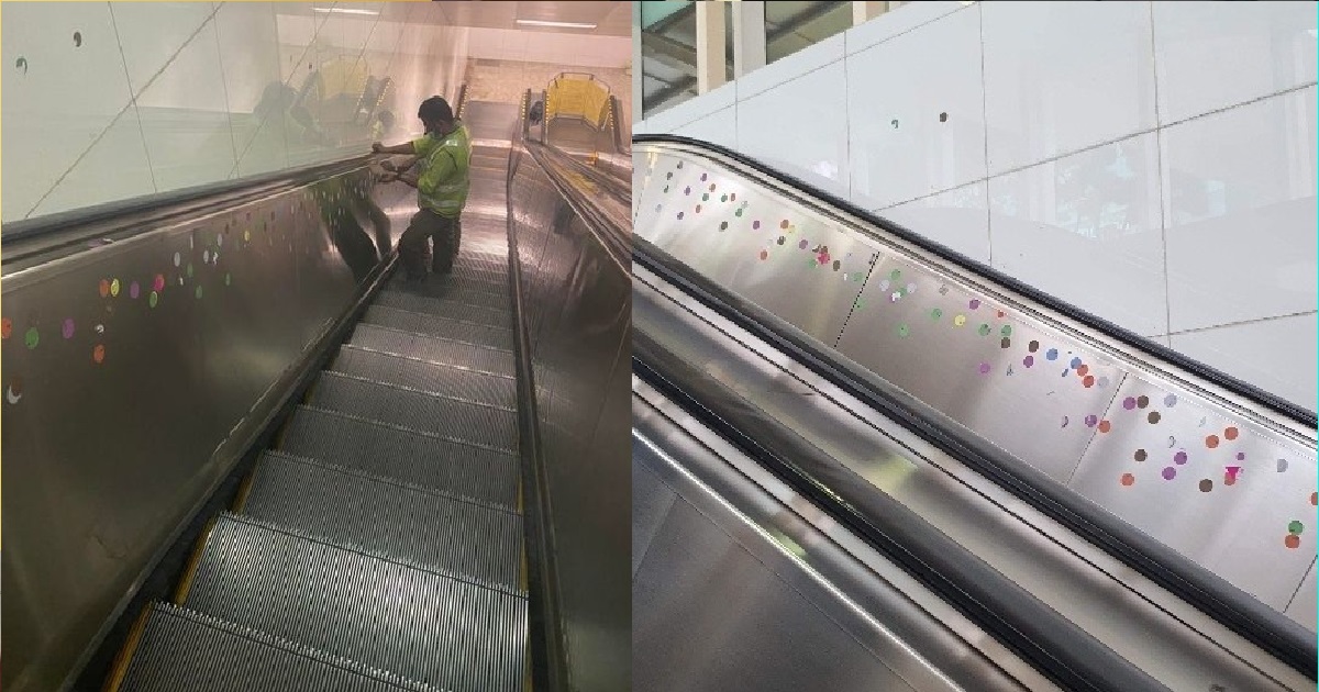 NOVENA ESCALATOR 'DECORATED' WITH STICKERS BY PEOPLE USING IT