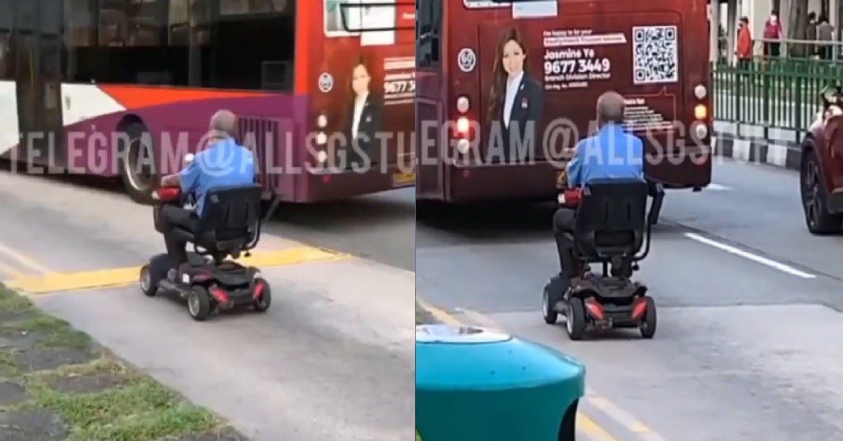 AH PEK RIDING HIS PMA ON THE BUS LANE, BLOCKING TRAFFIC BEHIND