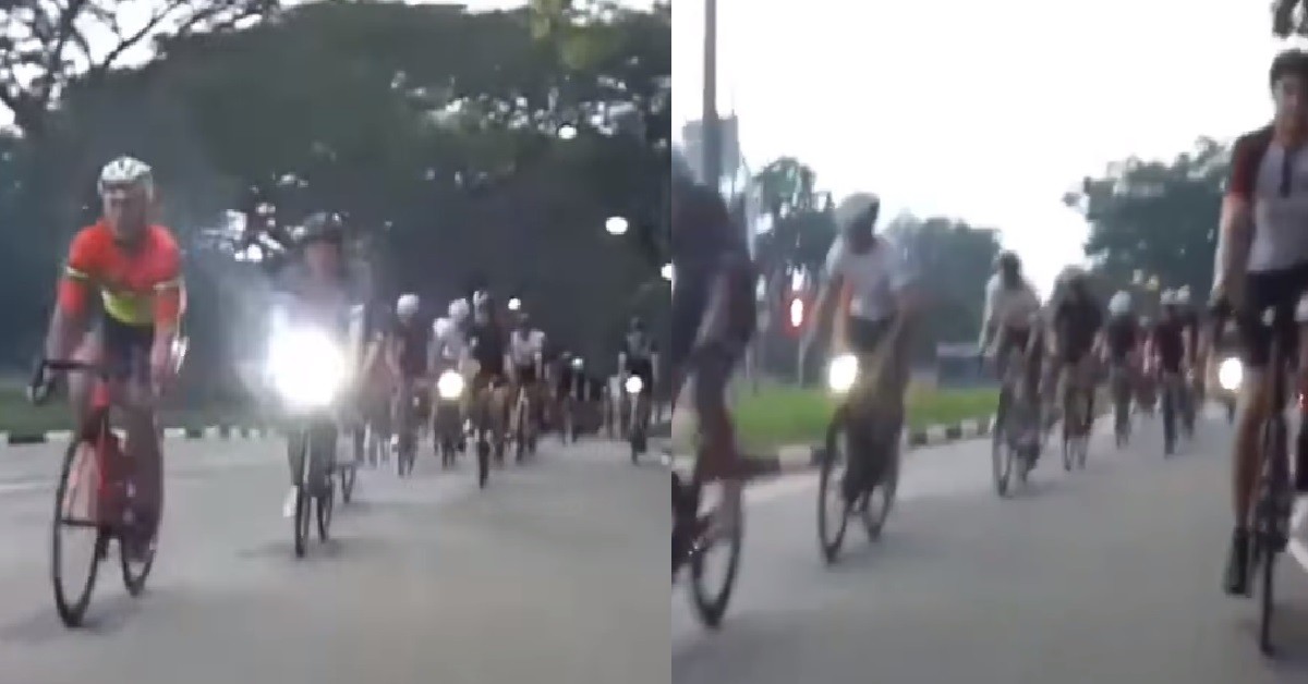 HUGE GROUP OF 38 CYCLISTS RIDING IN THE MIDDLE OF THE ROAD