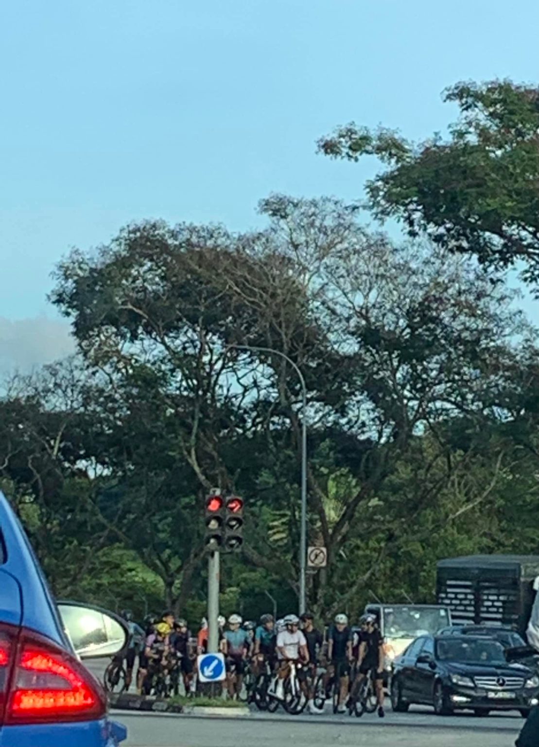 ERRANT GROUP OF MORE THAN 30 CYCLISTS CONGREGATING AT MANDAI ROAD