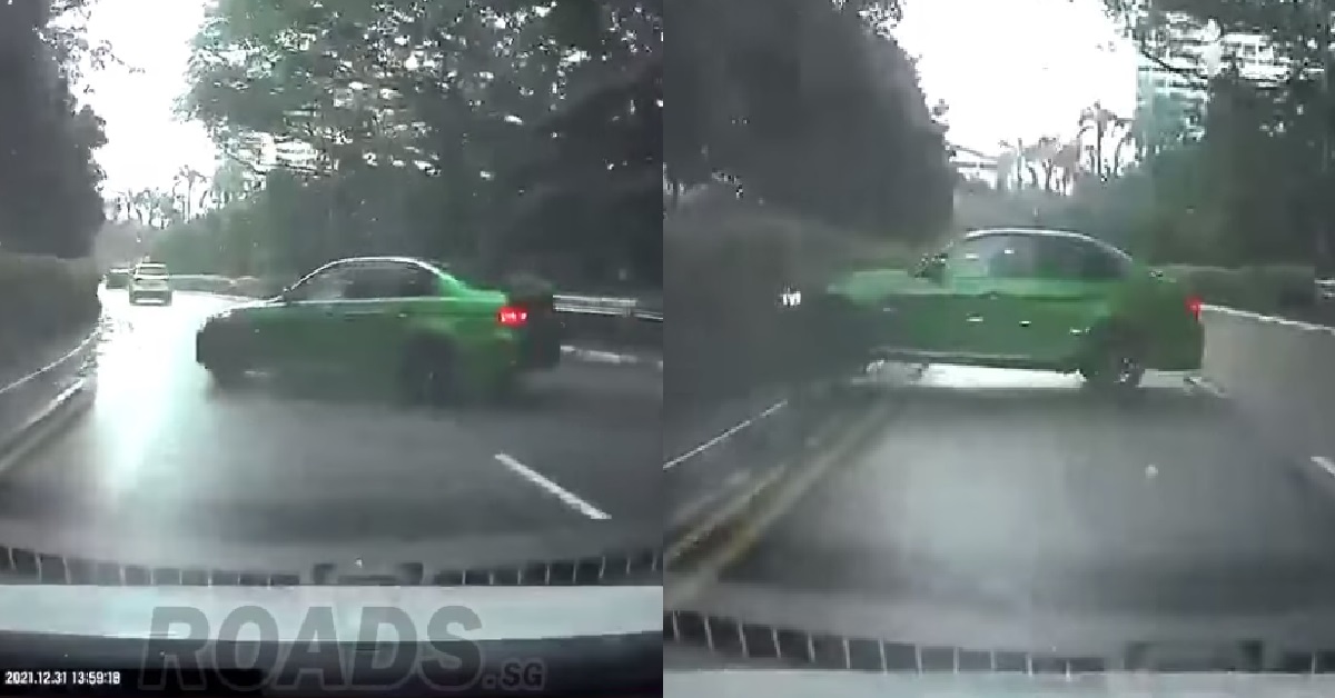 CAR SKIDS ON SLIPPERY ROAD AT ECP, SPINS 90 DEGREES AND CRASHES INTO KERB