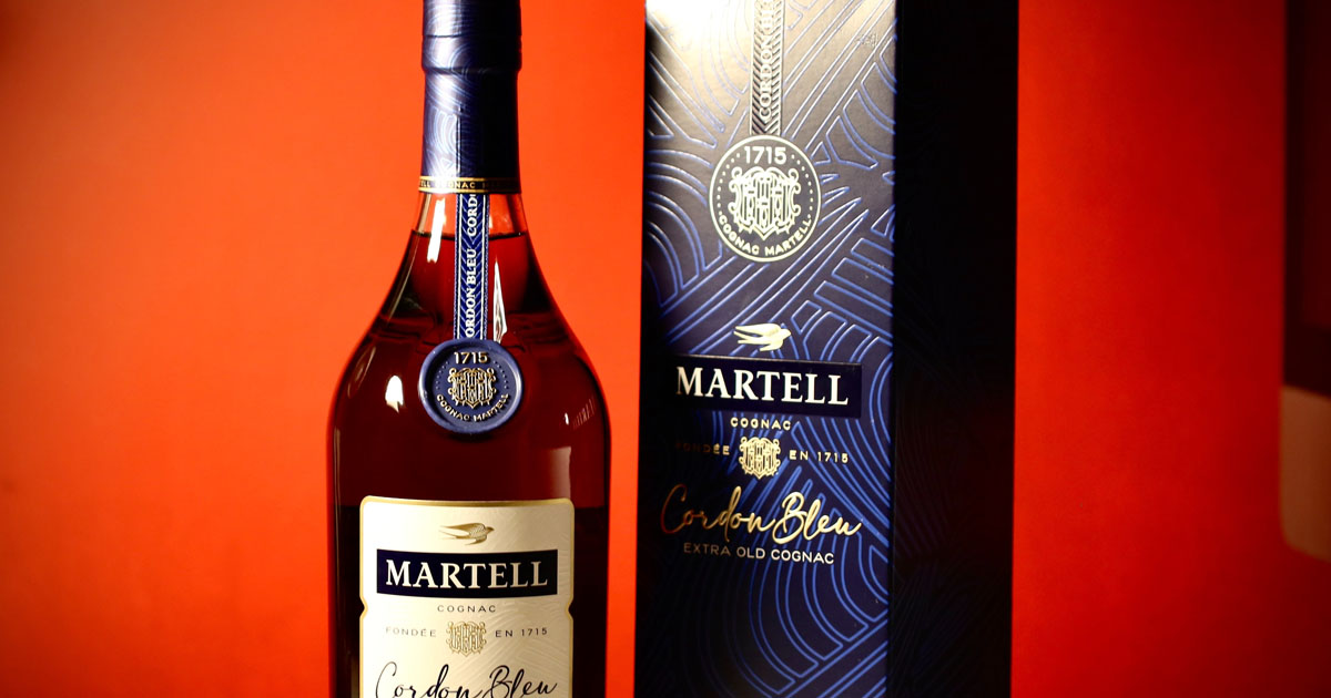 MAN SAYS HE'S HIGH CLASS BECAUSE HE DRINKS MARTELL CORDON BLEU WITH COKE