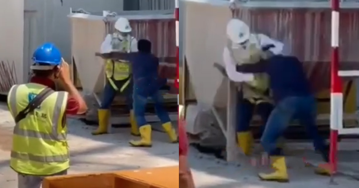 TWO CONSTRUCTION WORKERS FIGHTING, OTHERS BUSY WATCHING NO ONE STOP